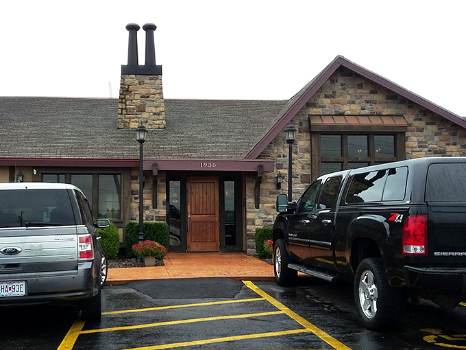 The stone facade of Jimm's stands proudly like a carnivore's castle, promising meaty treasures within. Even the shrubs look well-fed and happy.