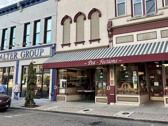 The charming storefront of Pea-Fections beckons from historic downtown Vincennes, promising sweet treasures behind that striped awning and vintage fa&ccedil;ade.