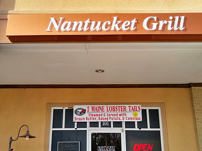 The unassuming facade of Nantucket Grill promises Maine lobster tails and coastal delights, proving great food often hides behind modest exteriors.