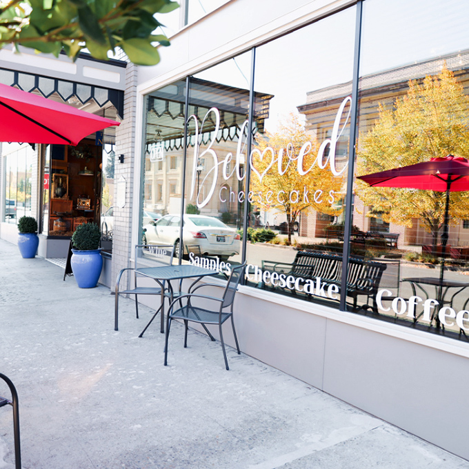 The storefront beckons with its charming simplicity, promising sweet treasures within. That "Free Cheesecake Samples" sign is the culinary equivalent of a siren song.