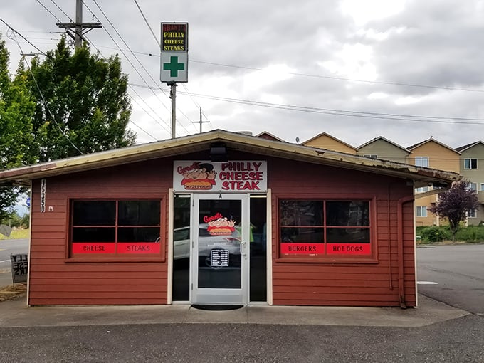 The unassuming burgundy exterior of Grant's might not scream "food destination," but that neon "OPEN" sign is your gateway to cheesesteak paradise.