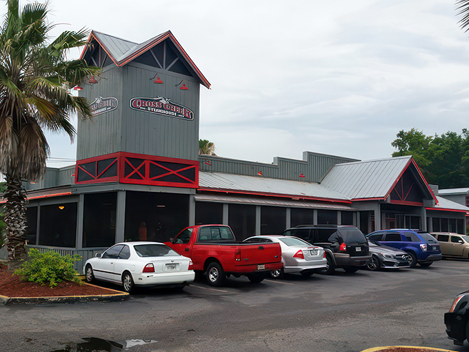 Cross Creek's neon-lit exterior transforms into a beacon of Southern comfort as dusk falls, promising culinary adventures within those wooden walls.