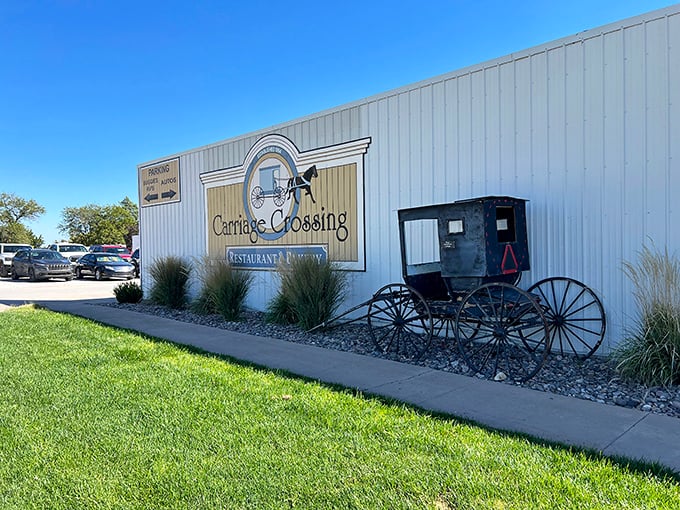 The iconic Carriage Crossing exterior stands proudly against the Kansas sky, complete with an authentic Amish buggy that isn't just for show.