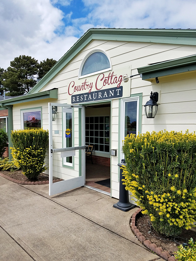 The unassuming yellow exterior of Country Cottage Restaurant stands like a beacon of comfort food hope in Woodburn, promising delicious secrets within.