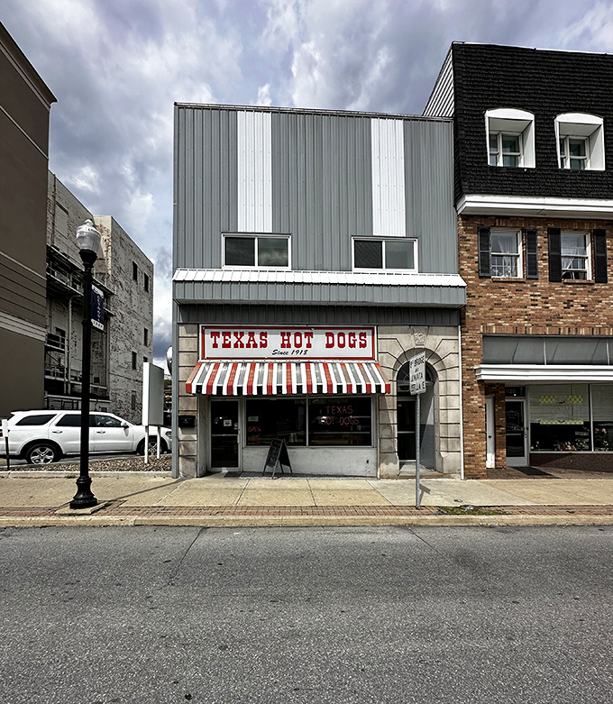 The iconic red and white striped awning of Texas Hot Dogs glows like a beacon for hungry travelers. A slice of Americana preserved on Altoona's 12th Avenue.