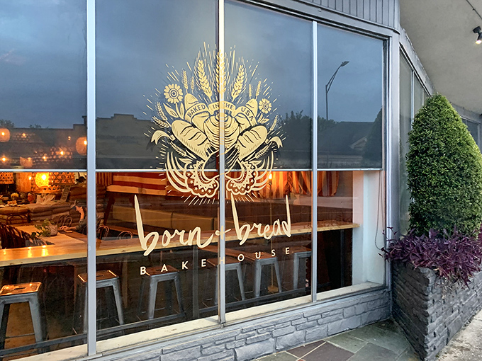 Colorful picnic tables under tan shade sails create an inviting oasis where carb-lovers gather like pilgrims at a delicious shrine.