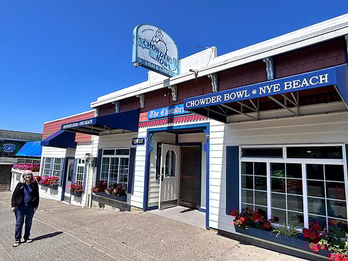 The classic coastal charm of The Chowder Bowl welcomes hungry travelers with its bright blue awnings and flower boxes&mdash;seafood paradise found!
