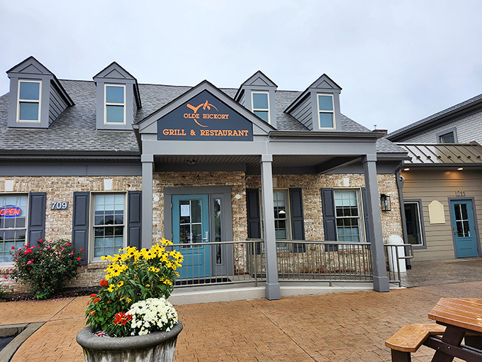 The stone facade and welcoming porch of Olde Hickory Grille promises comfort before you even step inside. Those colorful flower planters aren't just for show&mdash;they're a preview of the care that goes into everything here.