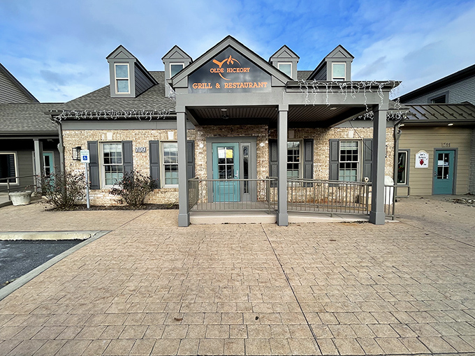 The stone facade and welcoming porch of Olde Hickory Grille promises comfort before you even step inside.