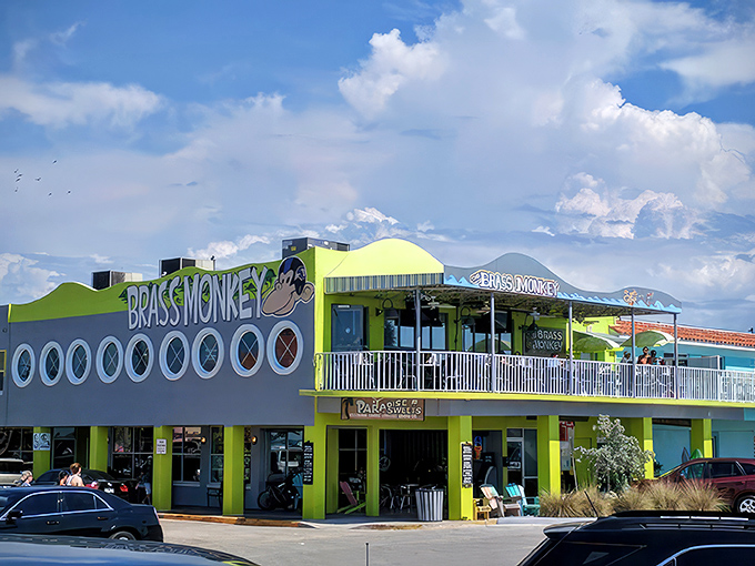The sunshine-yellow exterior of Brass Monkey stands out like a beacon of culinary hope on St. Pete Beach, promising good times on both levels.
