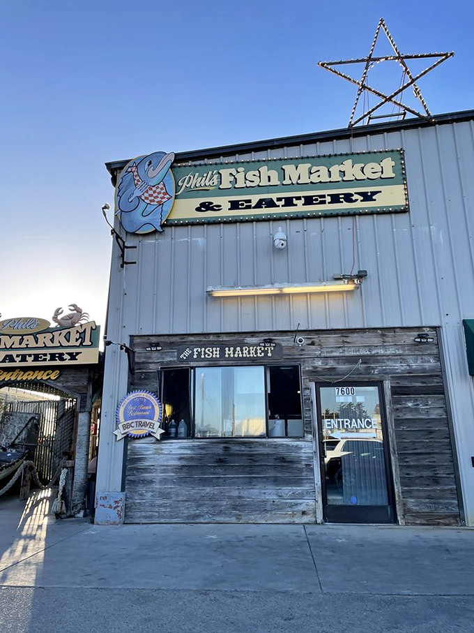 
The unassuming blue exterior of Phil's Fish Market & Eatery stands like a salty sea captain &ndash; weathered, unpretentious, and hiding treasures within.