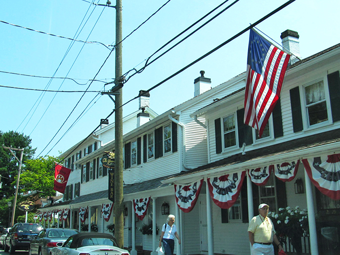 Main Street Essex doesn't just whisper New England charm—it shouts it with white picket fences, colonial architecture, and trees that have witnessed centuries of American history.