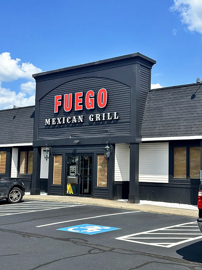 The understated exterior belies the flavor explosion waiting inside. Fuego's sleek black facade with bold red lettering makes a confident statement without the neon sombrero clich&eacute;s.