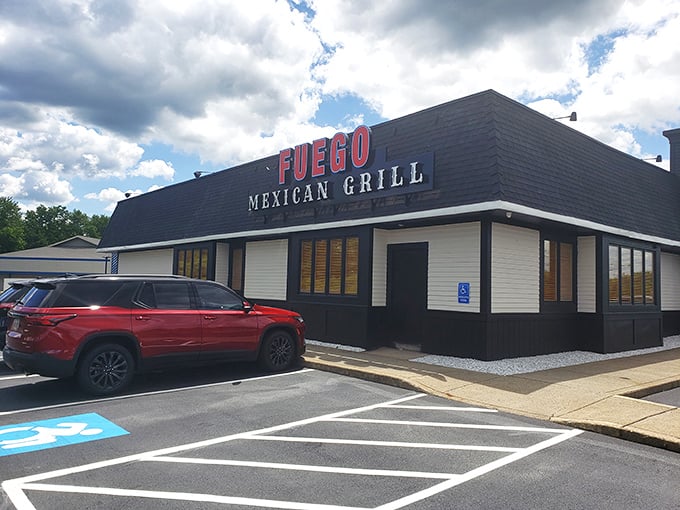 The understated exterior belies the flavor explosion waiting inside. Fuego's sleek black facade with bold red lettering makes a confident statement without the neon sombrero clich&eacute;s. 