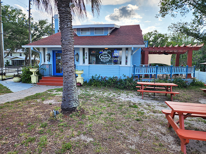 A blue cottage with palm trees and picnic tables that looks more like your favorite aunt's beach house than a restaurant. Culinary surprises hide in plain sight.