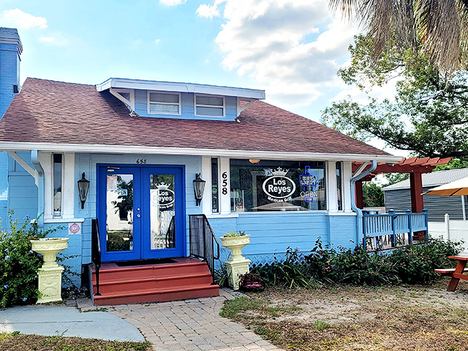 A blue cottage with palm trees and picnic tables that looks more like your favorite aunt's beach house than a restaurant. Culinary surprises hide in plain sight.