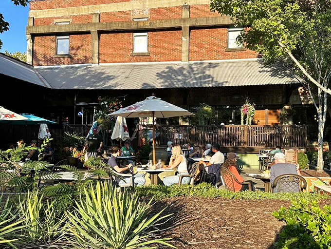 The iconic diamond-shaped sign of Coyote's Mexican Grill stands like a beacon of culinary promise against the Georgia sky. Brick patio, check. Umbrella tables, check. Enchilada paradise, double check.
