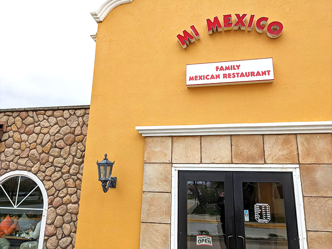 The sunshine-yellow exterior of Mi Mexico stands like a beacon of culinary promise in Clive, inviting hungry travelers to step inside and discover authentic flavors.