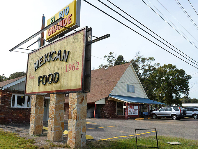 The unassuming A-frame exterior with its bright blue awning and red signage is like a secret handshake—those who know, know.