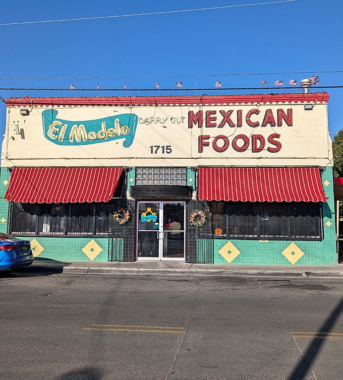 The turquoise and cream exterior of El Modelo stands like a beacon of culinary promise on Second Street, its vintage sign practically whispering "authentic Mexican food inside."