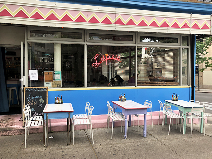 The blue storefront of Lupe's stands out on the corner like a colorful oasis in SoHo's urban landscape, beckoning hungry passersby with the promise of authentic Mexican flavors.