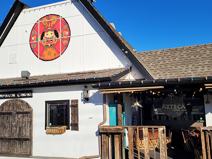 The charming A-frame exterior with its welcoming red umbrellas feels like discovering a secret portal to Mexico right in Oklahoma City.