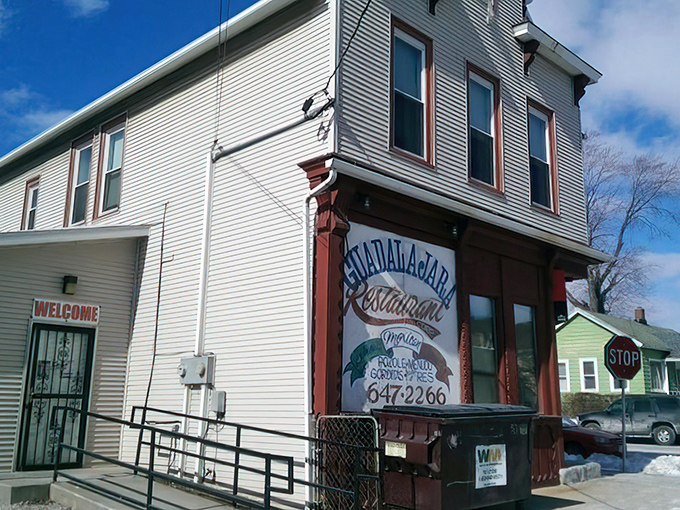Guadalajara Restaurant's unassuming white exterior with bold red awnings stands like Milwaukee's best-kept culinary secret hiding in plain sight.