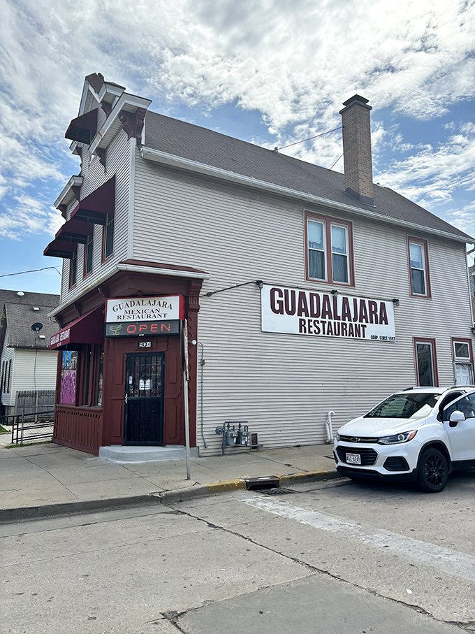 Guadalajara Restaurant's unassuming white exterior with bold red awnings stands like Milwaukee's best-kept culinary secret hiding in plain sight.
