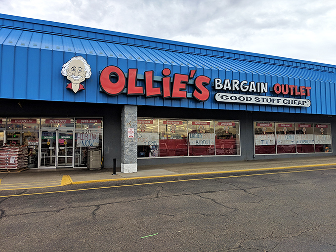 The blue facade of Ollie's stands like a beacon of bargains, with its cartoon mascot promising "Good Stuff Cheap" to savvy Ohio shoppers.