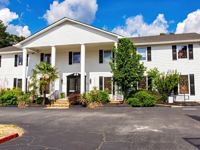 Southern charm meets textile heaven in this stately white mansion. Who knew fabric shopping could come with columns and palm trees?