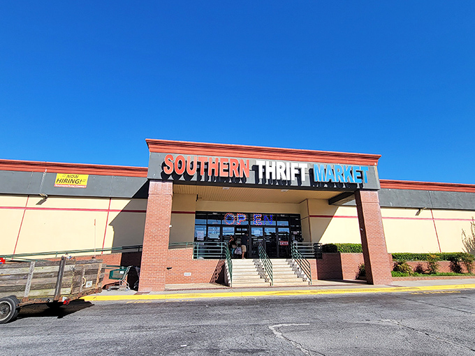 The Southern Thrift Market stands proudly against a blue Georgia sky, its colorful sign promising adventures in secondhand treasures within.