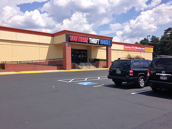 The Southern Thrift Market stands proudly against a blue Georgia sky, its colorful sign promising adventures in secondhand treasures within.