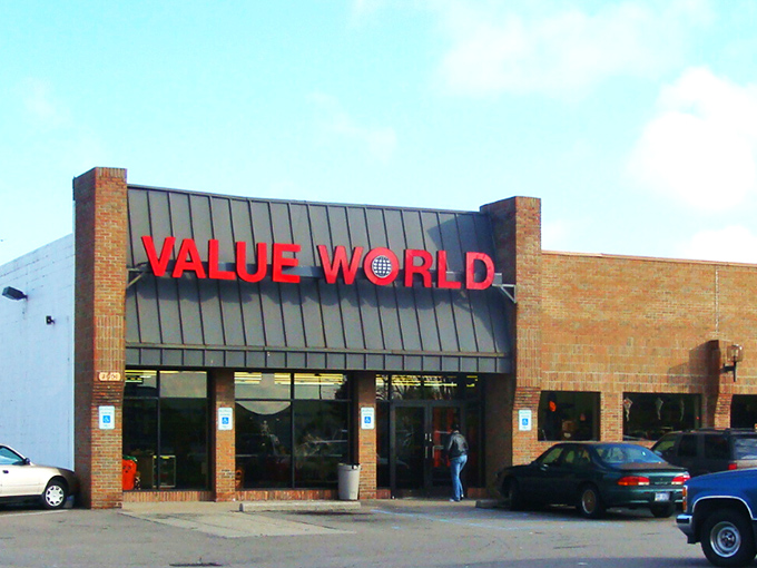 The brick facade of Value World stands proudly against a blue Michigan sky, like a fortress guarding treasures waiting to be discovered.