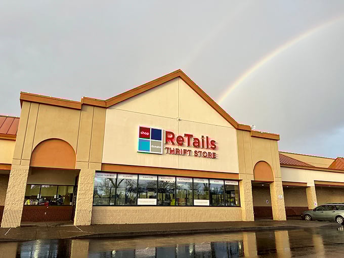 A rainbow arches over ReTails Thrift Store like nature's own "Grand Opening" banner, promising treasures at the end of your bargain-hunting journey.