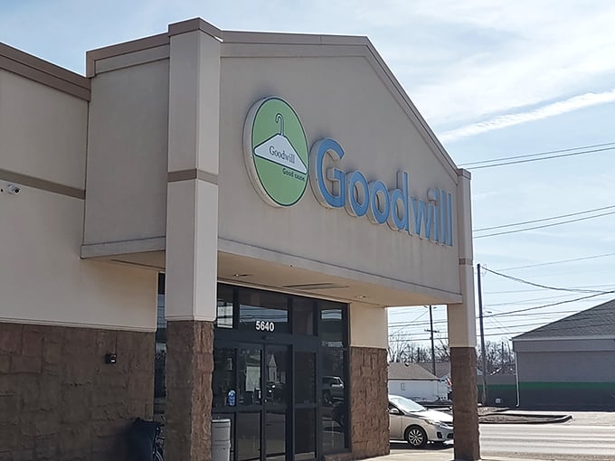 The white building with blue trim isn't trying to win architectural awards—it's saving its energy for the treasure hunt waiting inside.