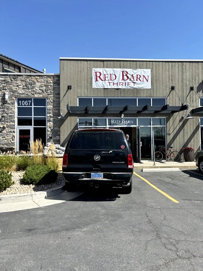 The modern barn-inspired exterior of Red Barn Thrift stands proudly against Utah's blue sky, promising treasures within that are anything but ordinary.