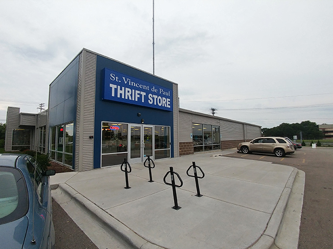 The distinctive blue facade of St. Vincent de Paul stands like a beacon for bargain hunters on Odana Road, promising treasures within.