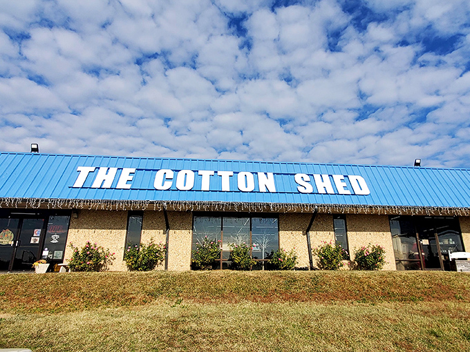 The bright blue roof of The Cotton Shed beckons like a retail oasis in Searcy, promising treasures inside that big box stores could only dream about.