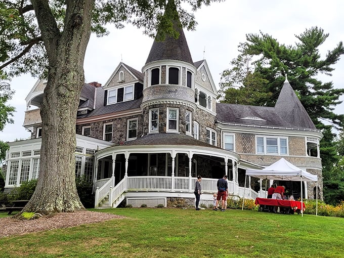 Auburn Heights mansion stands like a Victorian dream, its turret and wrap-around porch whispering tales of Gilded Age splendor and steam-powered adventures.