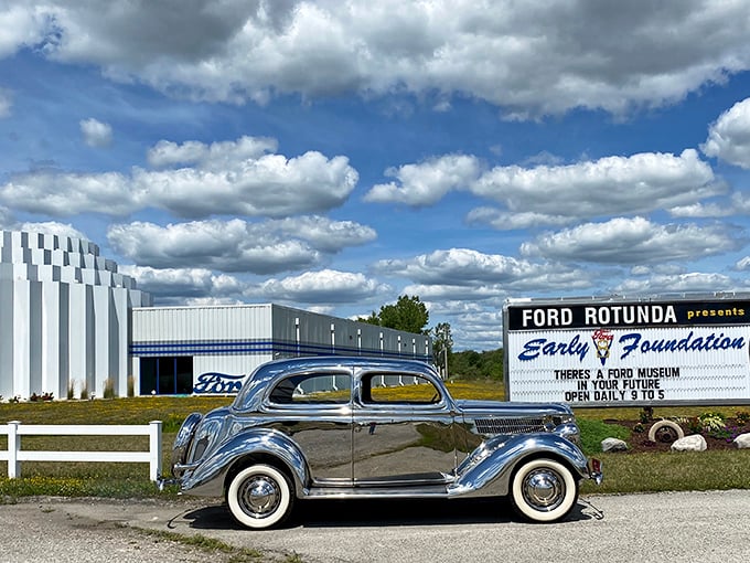 The sleek Art Deco-inspired exterior of the Early Ford V-8 Museum beckons car enthusiasts with its distinctive blue striping and retro styling. Automotive heaven awaits.
