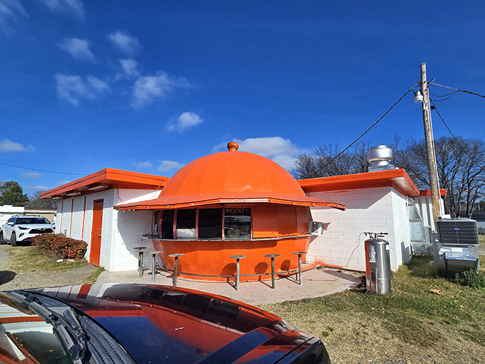 The giant orange dome isn't a mirage—it's architectural whimsy serving up comfort food. Like finding a citrus spaceship that decided to land in Redfield and start flipping pancakes.