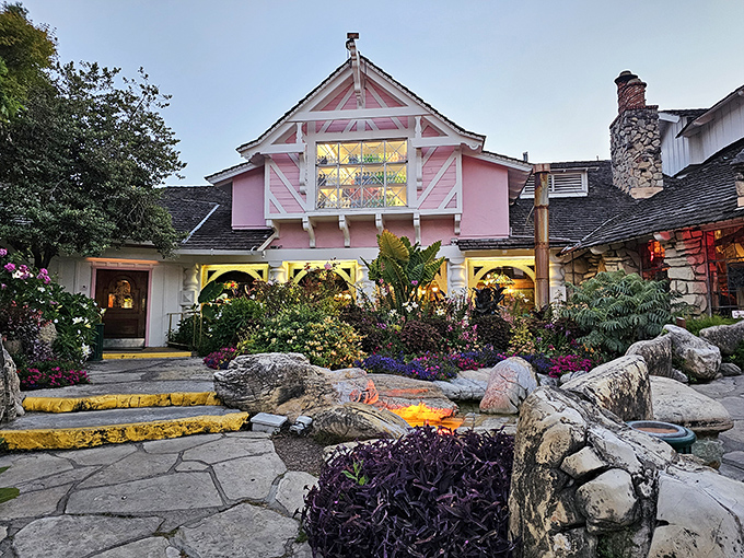 The pink fairytale castle of Copper Cafe glows at dusk, proving that sometimes the most magical dining experiences come in the most unexpected packages.