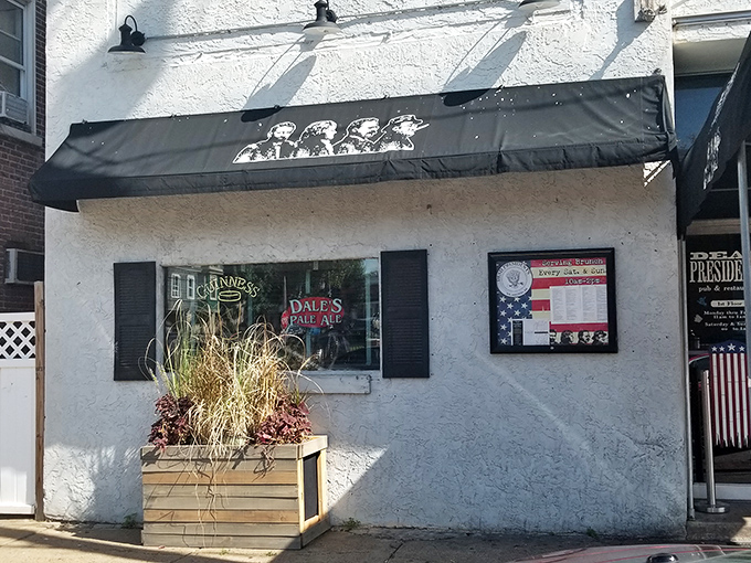 The iconic Dead Presidents sign welcomes patrons with silhouettes of Lincoln, Jefferson, Roosevelt, and Washington &ndash; history class never looked this appetizing.