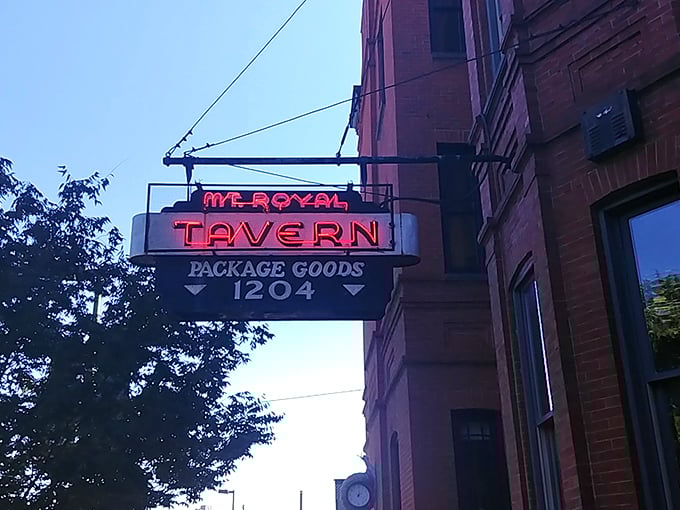 The iconic neon sign beckons like a lighthouse for thirsty souls, promising refuge and revelry at Baltimore's beloved Mt. Royal Tavern.
