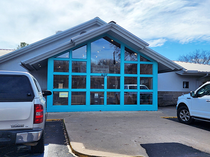 The turquoise-framed entrance beckons like a culinary lighthouse, promising seafood treasures within this unassuming Fayetteville institution.
