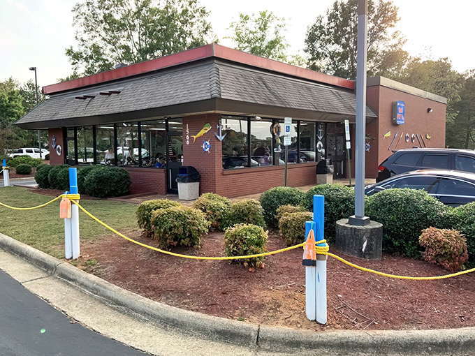 The red-trimmed roof of Carolina Fish Fry Co. beckons seafood lovers like a lighthouse calling ships to shore, even on rainy Garner afternoons.
