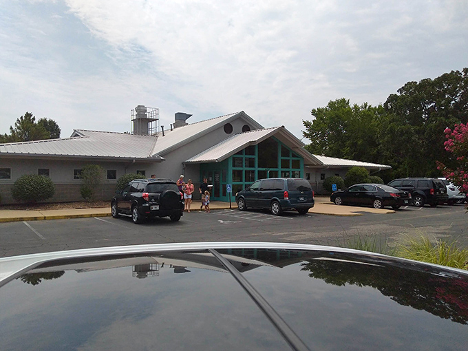 The turquoise-framed entrance beckons like a culinary lighthouse, promising seafood treasures within this unassuming Fayetteville institution.
