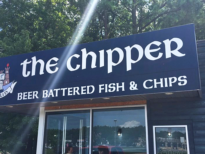 The blue facade of The Chipper stands like a beacon of British comfort food amid Virginia greenery, promising authentic fish and chips to weary travelers.