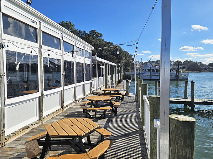 The waterfront deck at Dockside is where seafood dreams come true&mdash;picnic tables, gentle waves, and the promise of fresh catches just steps away.