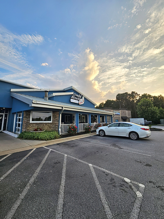 The bright blue exterior of Coastal Breeze stands out like a maritime mirage in landlocked Buford, promising seafood treasures within.